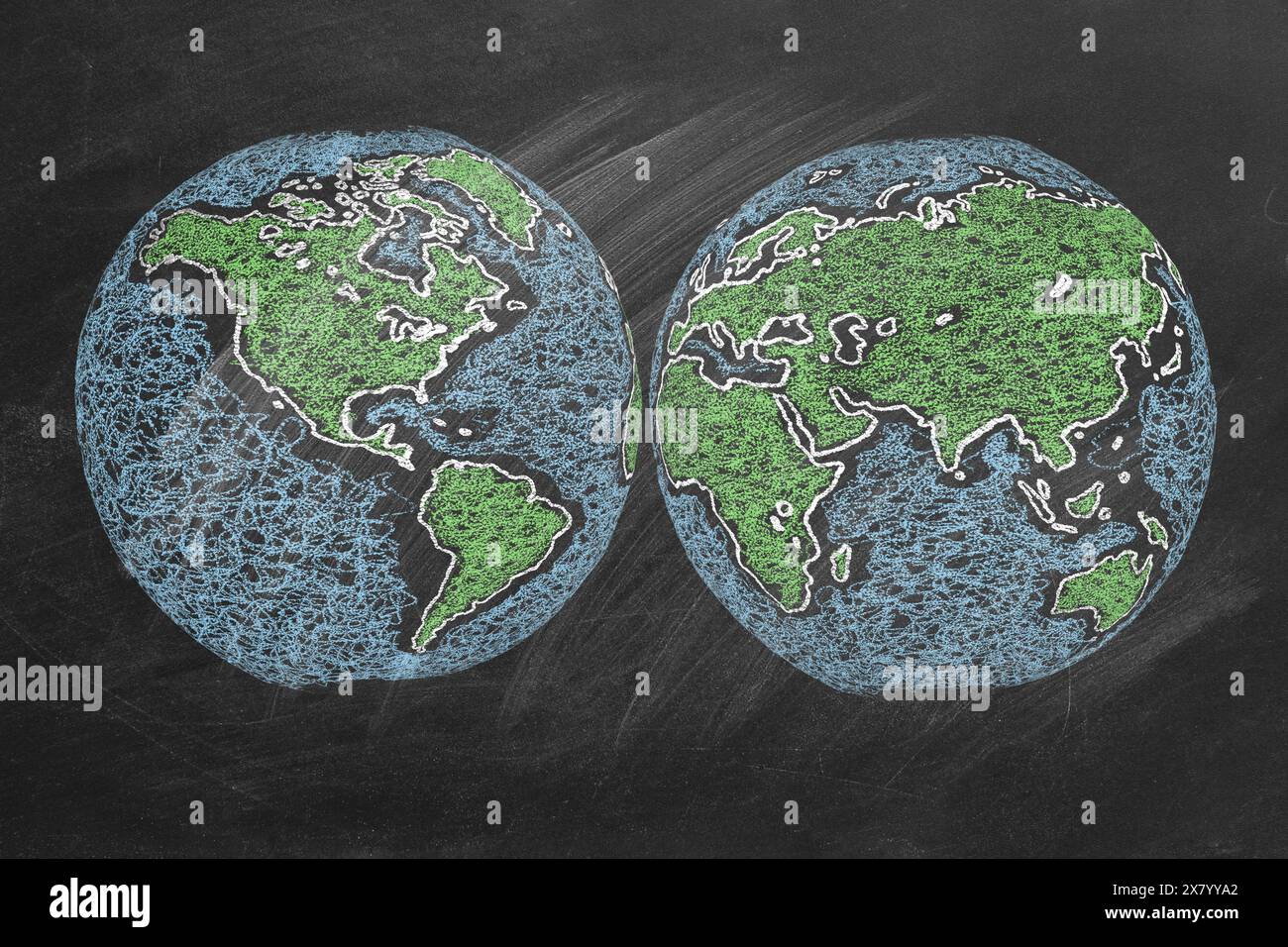 Chalk illustrations of the Earth hemispheres, drawn on a blackboard ...