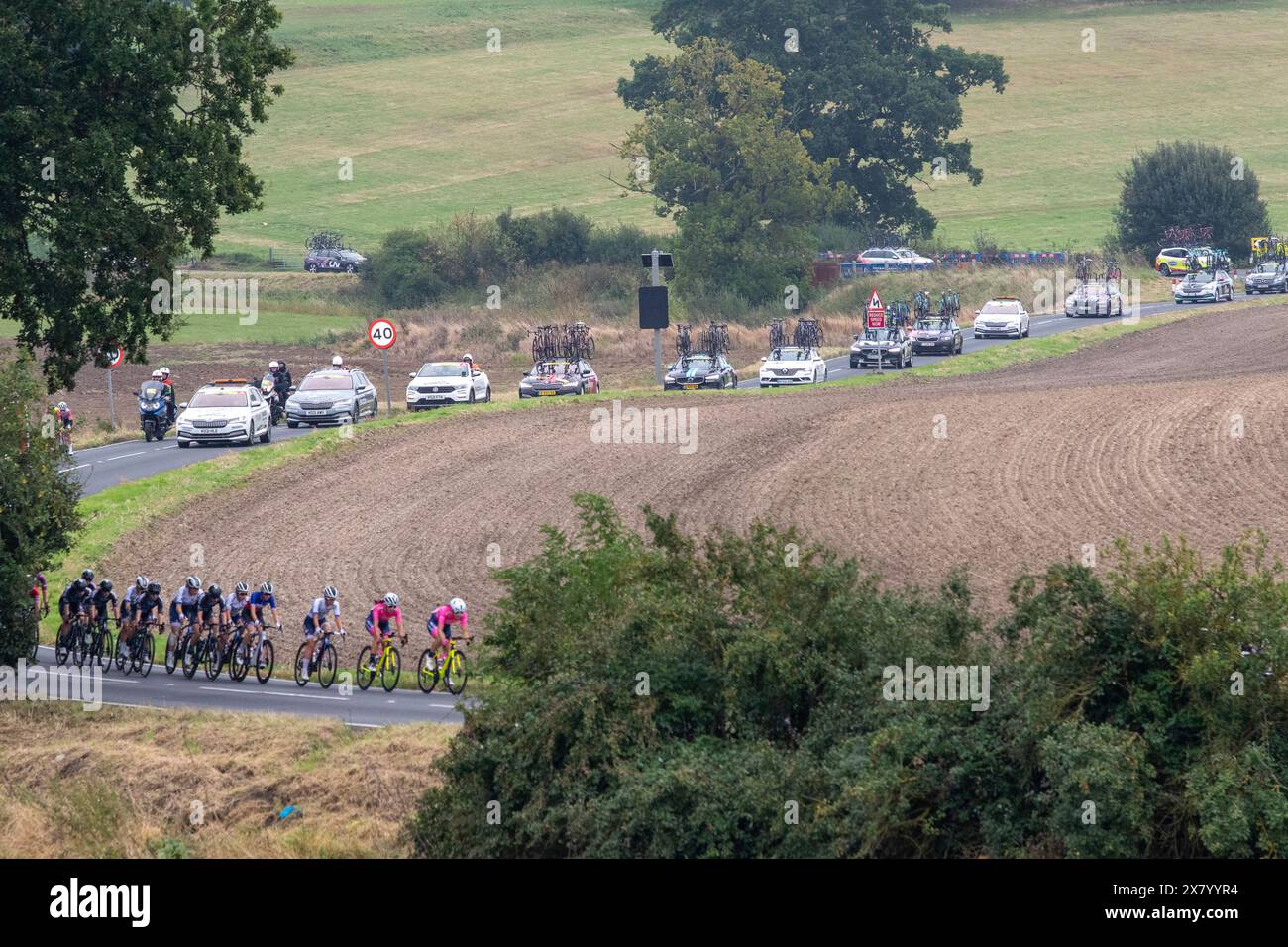 The peloton in the 2021 UK Women's Tour on the B1352 a country road ...