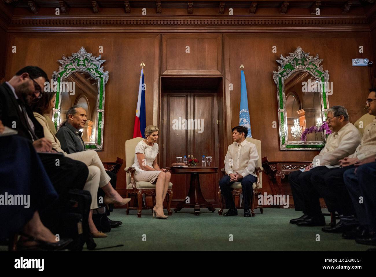 Queen Maxima of the Netherlands, 4th from left, speaks with Philippine ...