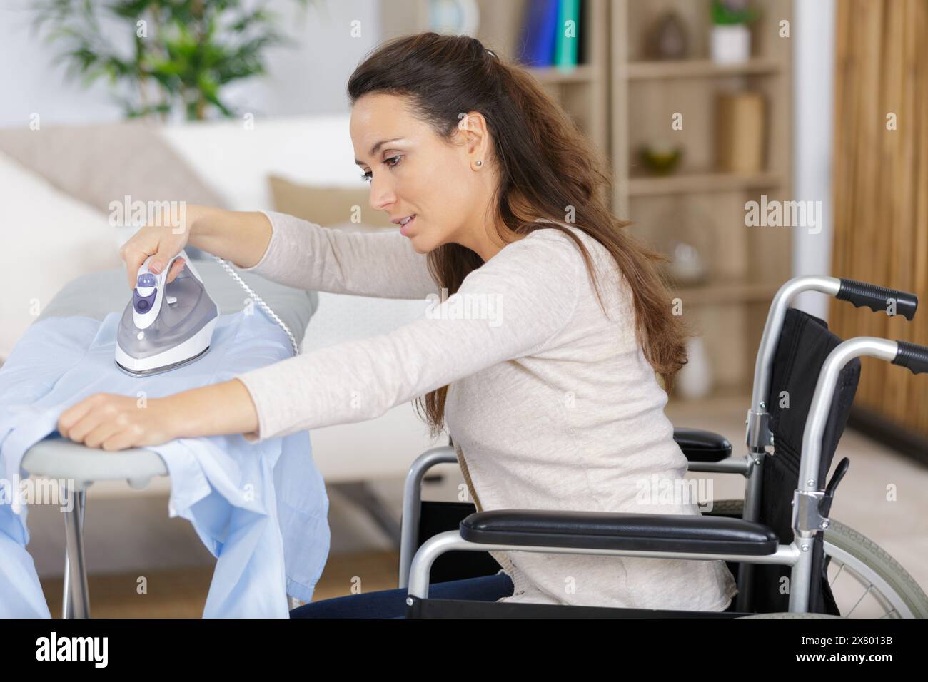 handicaped person doing her housekeeping Stock Photo - Alamy