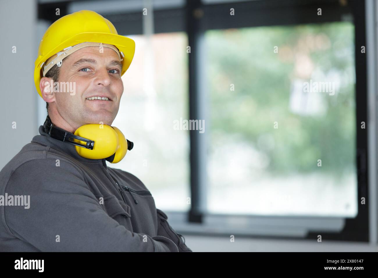 construction worker is looking at camera Stock Photo - Alamy