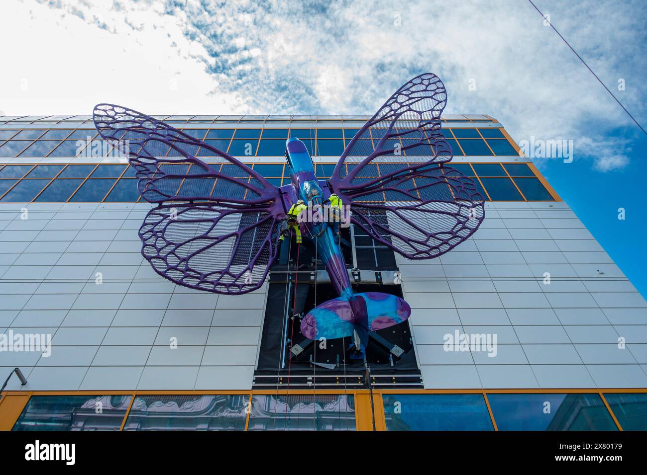 Installation of artworks on the facade of renovated Maj department ...