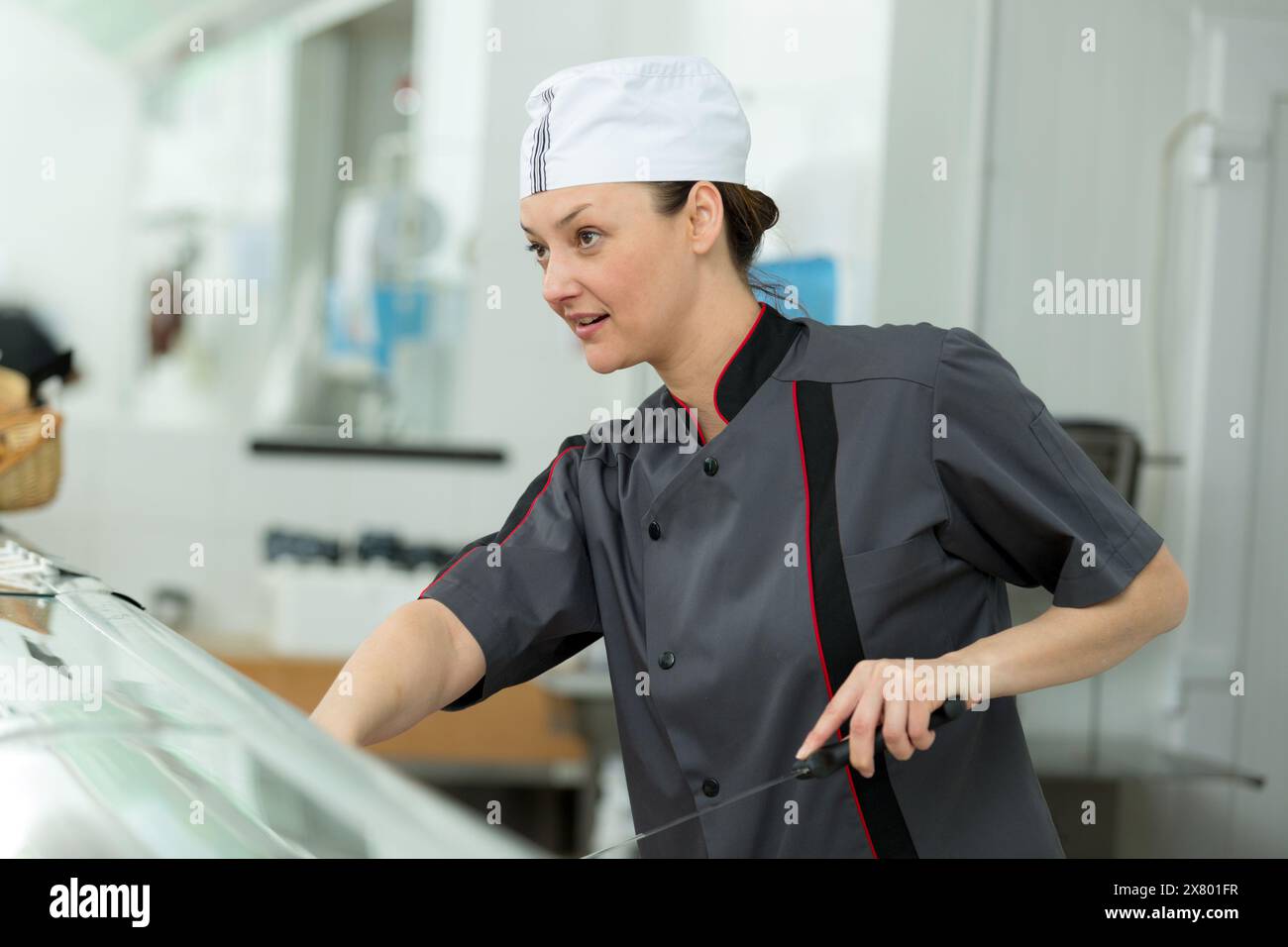 buffet female worker servicing food in cafeteria Stock Photo - Alamy