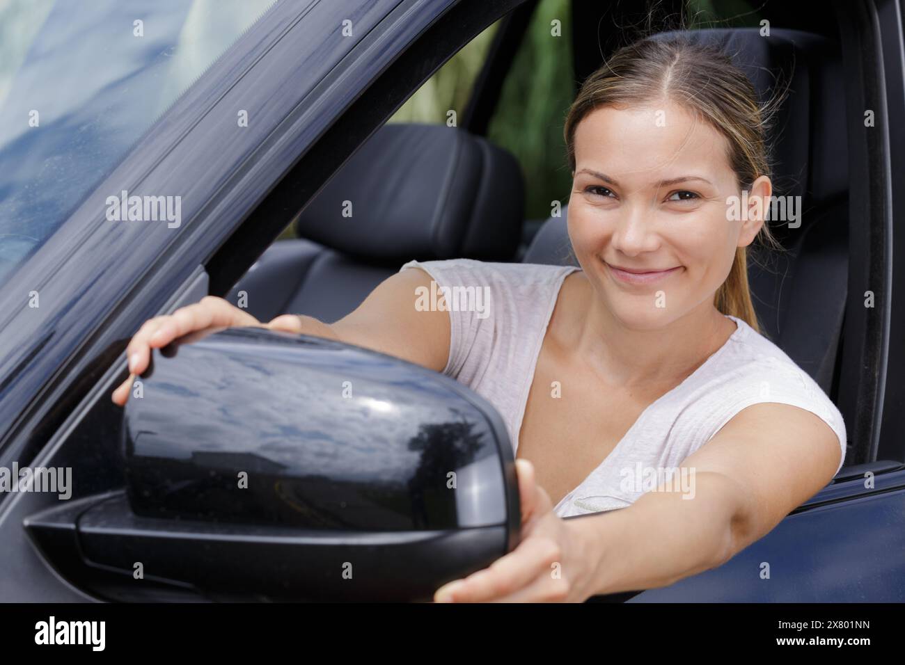 pretty smiling girl driving a car Stock Photo - Alamy