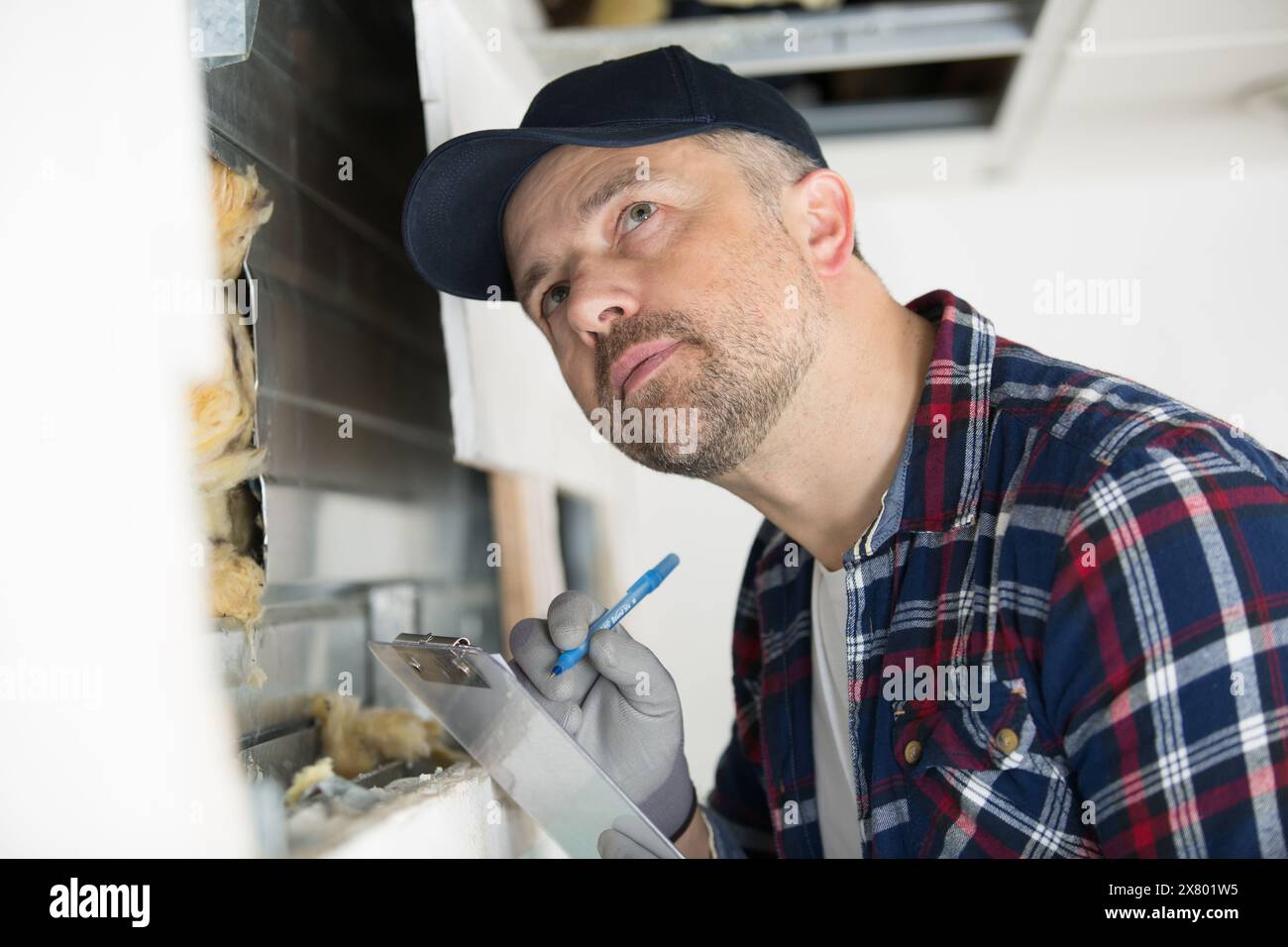 male architect during window survey Stock Photo - Alamy