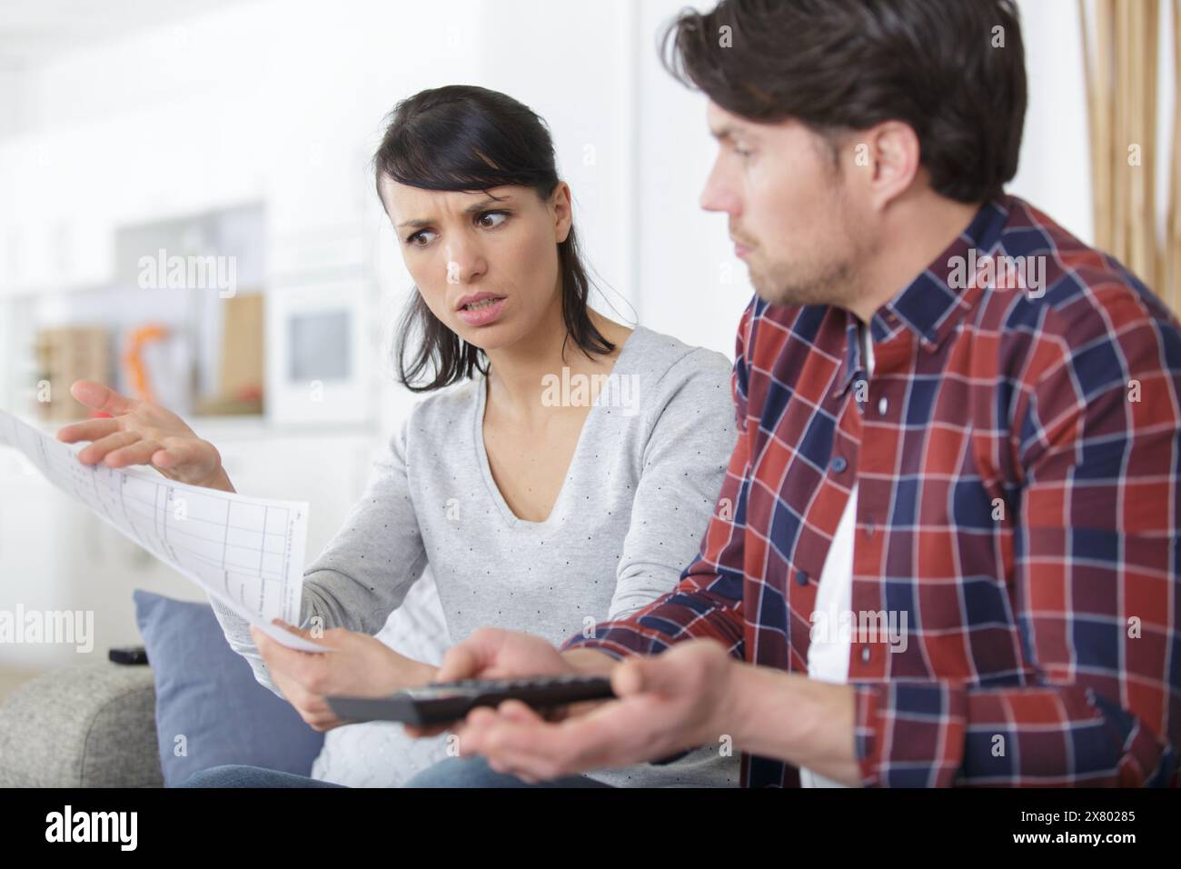 couple arguing while calculating their finances Stock Photo - Alamy