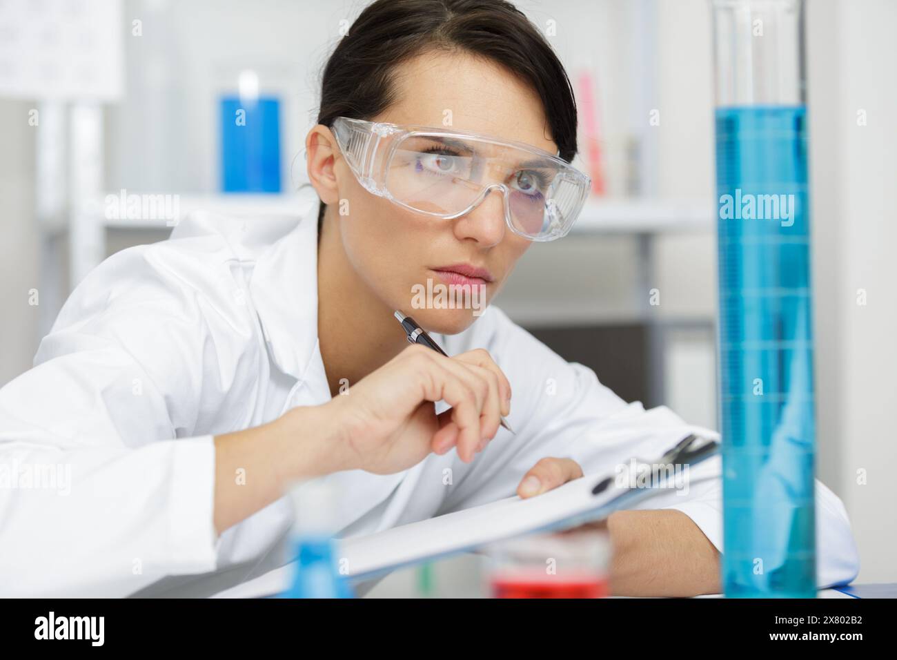 female lab working checking the results Stock Photo - Alamy