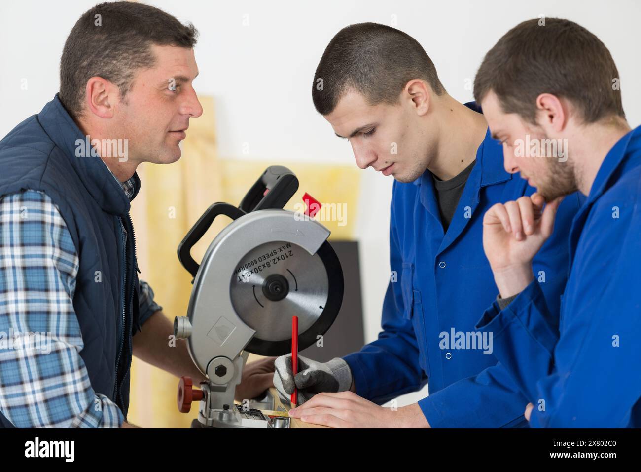 the apprentices using circular saw Stock Photo - Alamy