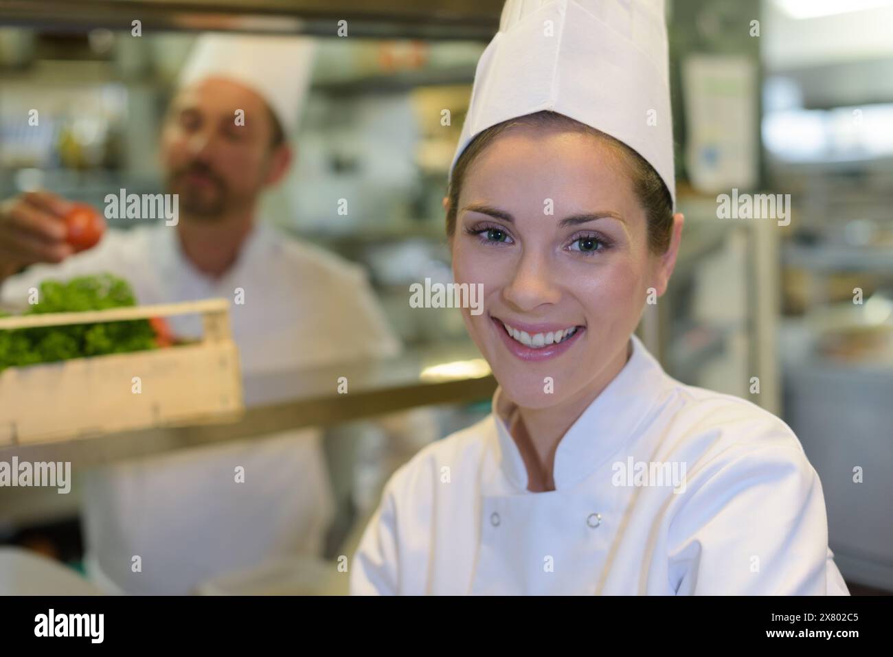 a happy female chef smiling Stock Photo - Alamy