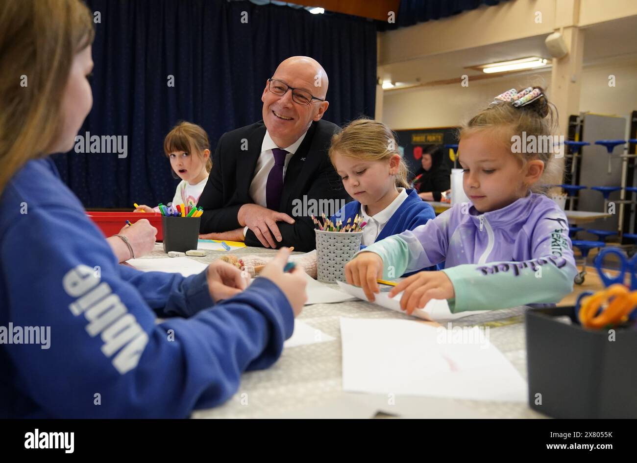 First Minister John Swinney chats to pupils during a visit to a ...