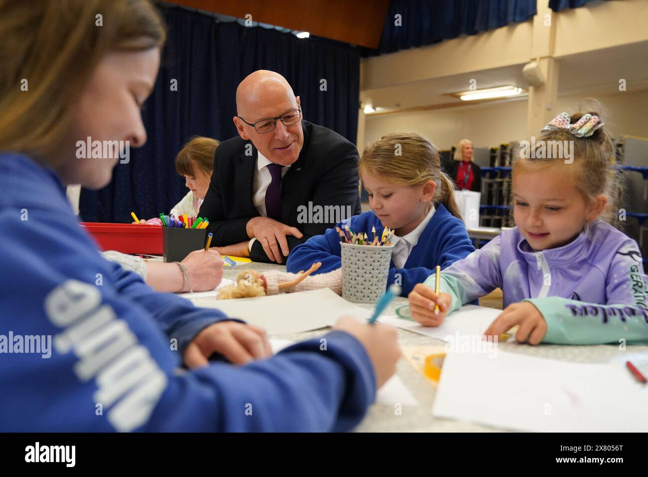 First Minister John Swinney chats to pupils during a visit to a ...