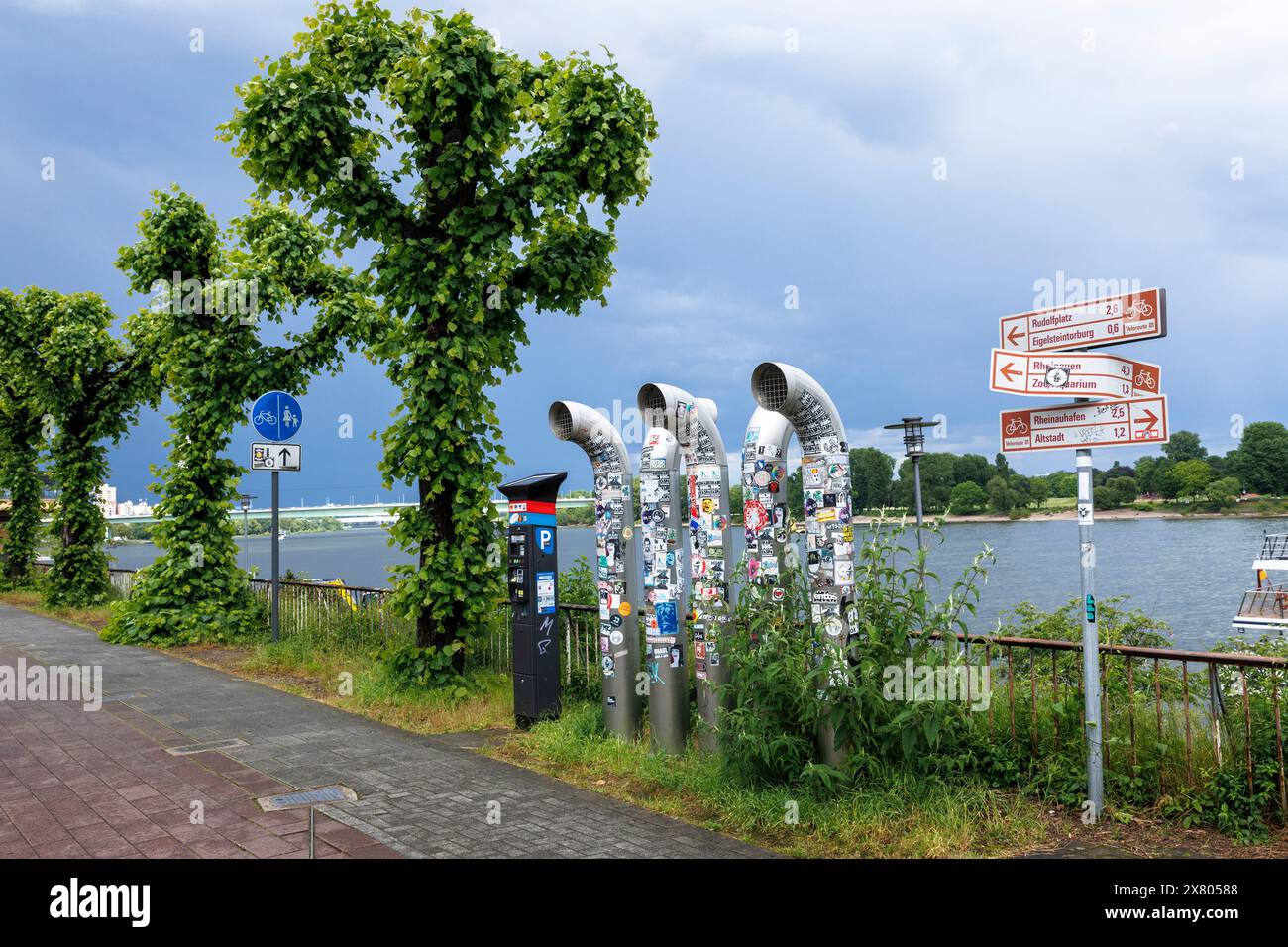 ventilation pipes on the banks of the Rhine covered with many stickers ...