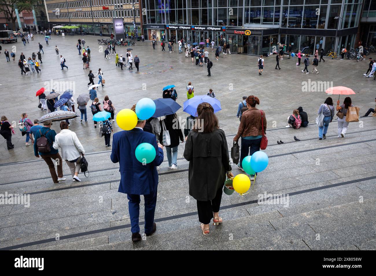 man and woman with balloons on the stairs from the cathedral square to ...