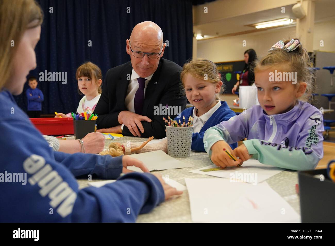 First Minister John Swinney chats to pupils during a visit to a ...