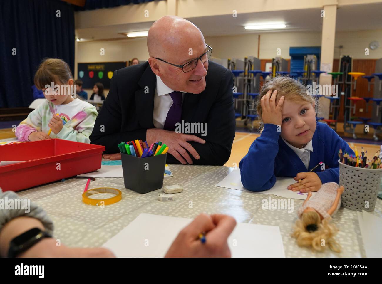 First Minister John Swinney chats to pupils during a visit to a ...