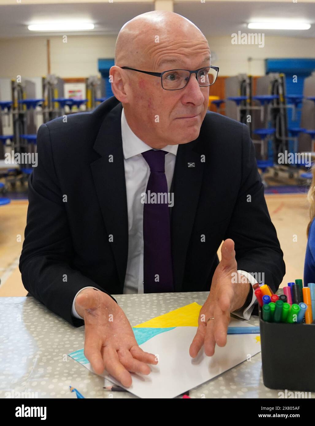 First Minister John Swinney chats to pupils during a visit to a ...