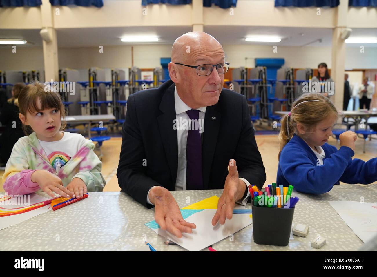 First Minister John Swinney chats to pupils during a visit to a ...