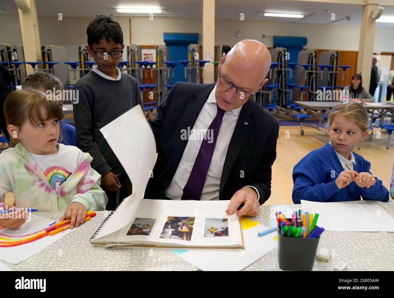 First Minister John Swinney chats to pupils during a visit to a ...