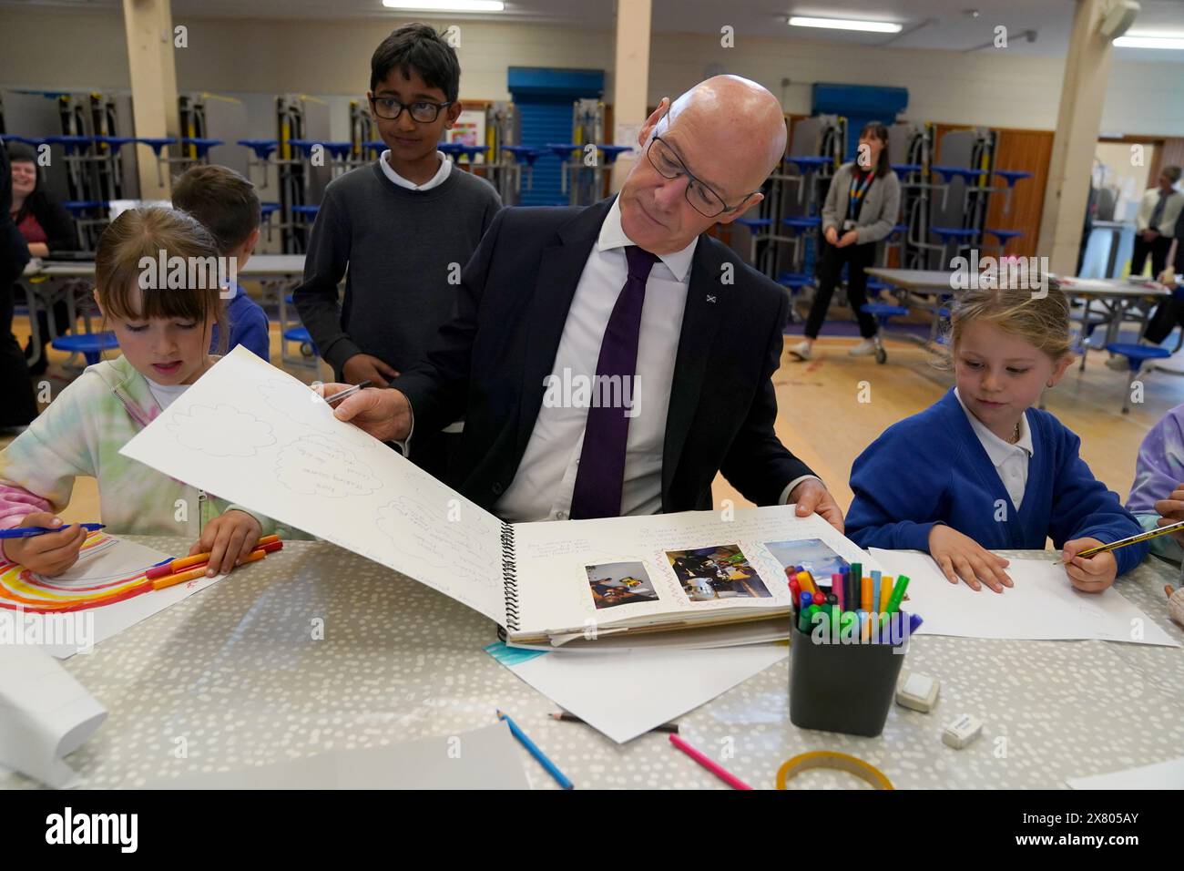 First Minister John Swinney chats to pupils during a visit to a ...