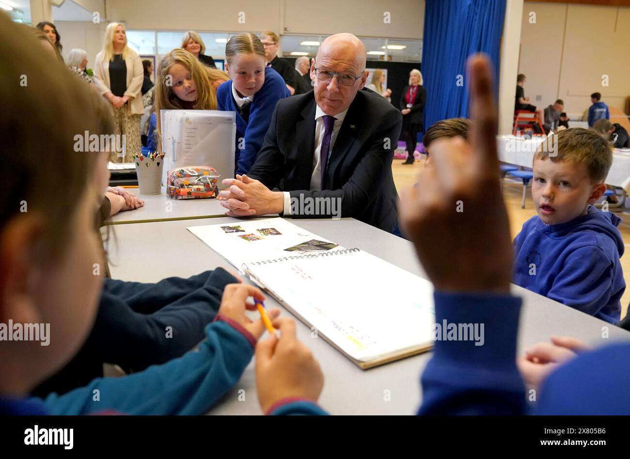 First Minister John Swinney chats to pupils during a visit to a ...