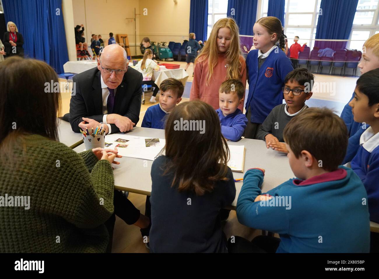 First Minister John Swinney chats to pupils during a visit to a ...