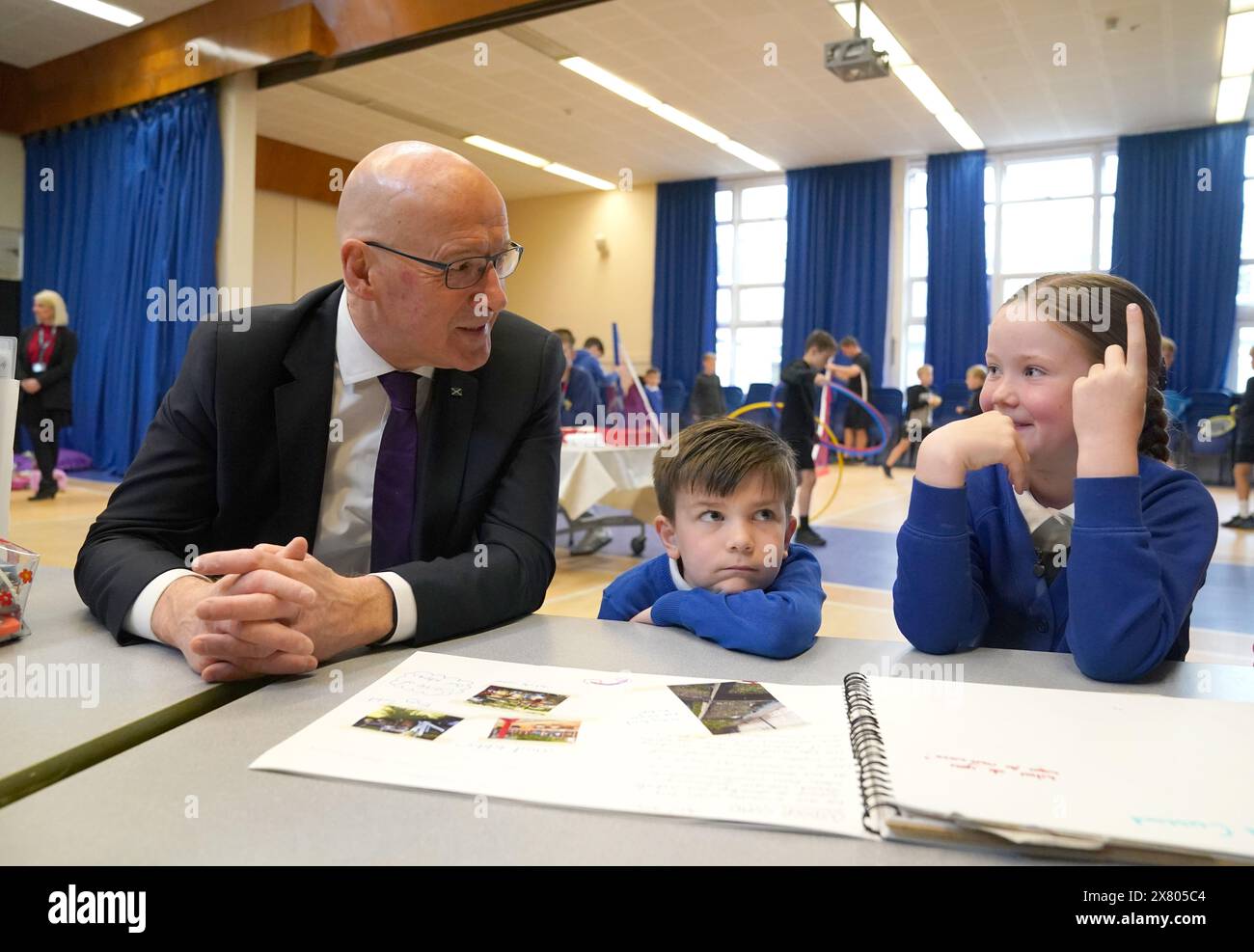 First Minister John Swinney chats to pupils during a visit to a ...