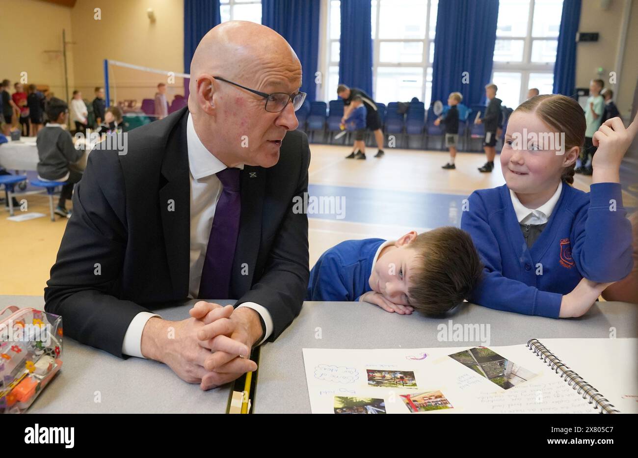 First Minister John Swinney chats to pupils during a visit to a ...