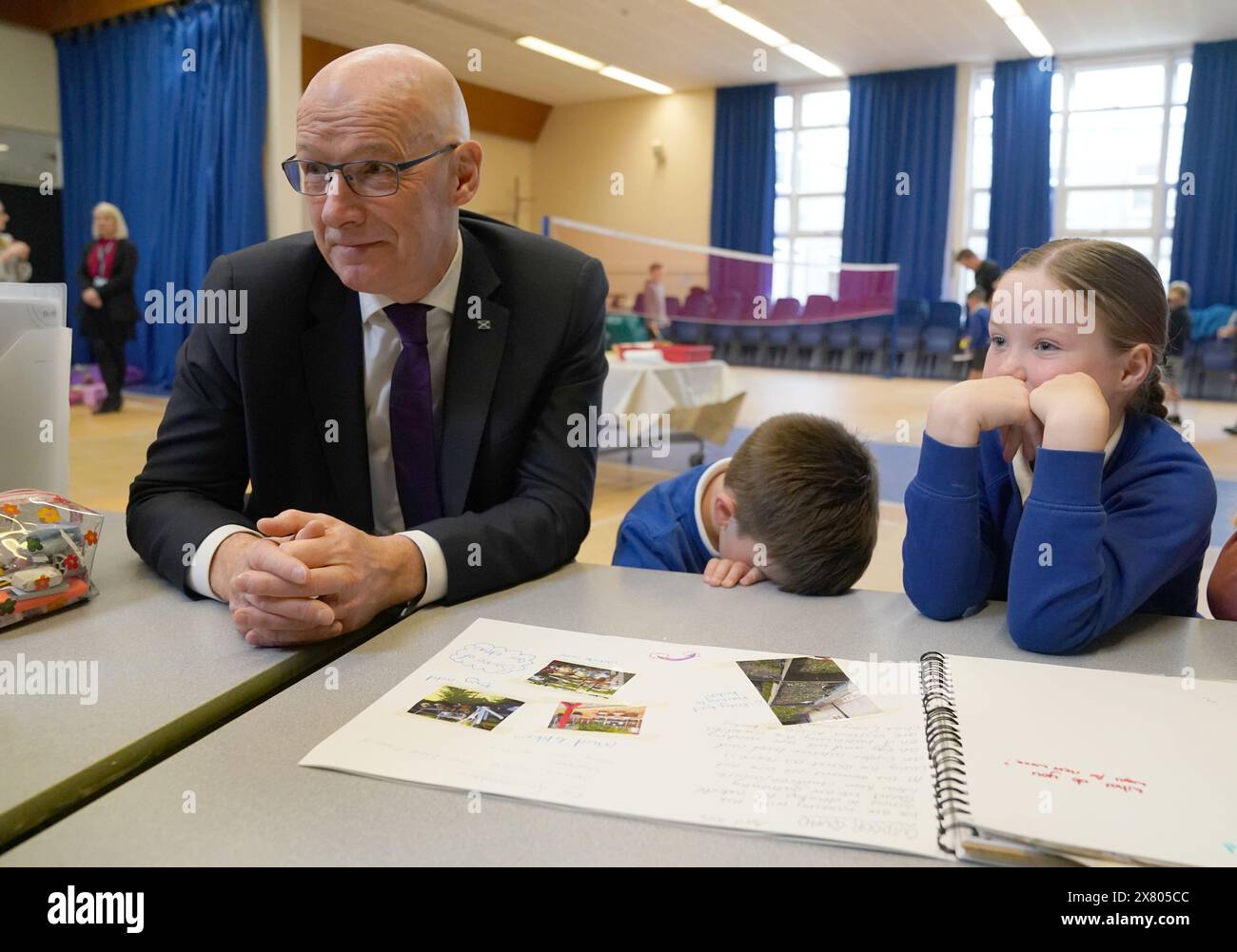First Minister John Swinney chats to pupils during a visit to a ...