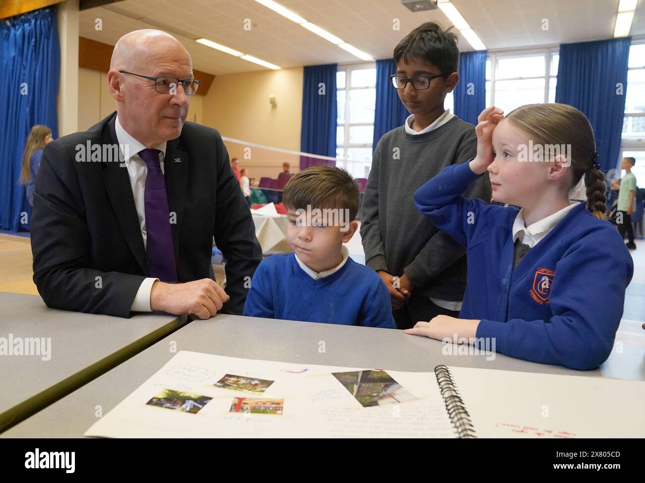 First Minister John Swinney chats to pupils during a visit to a ...