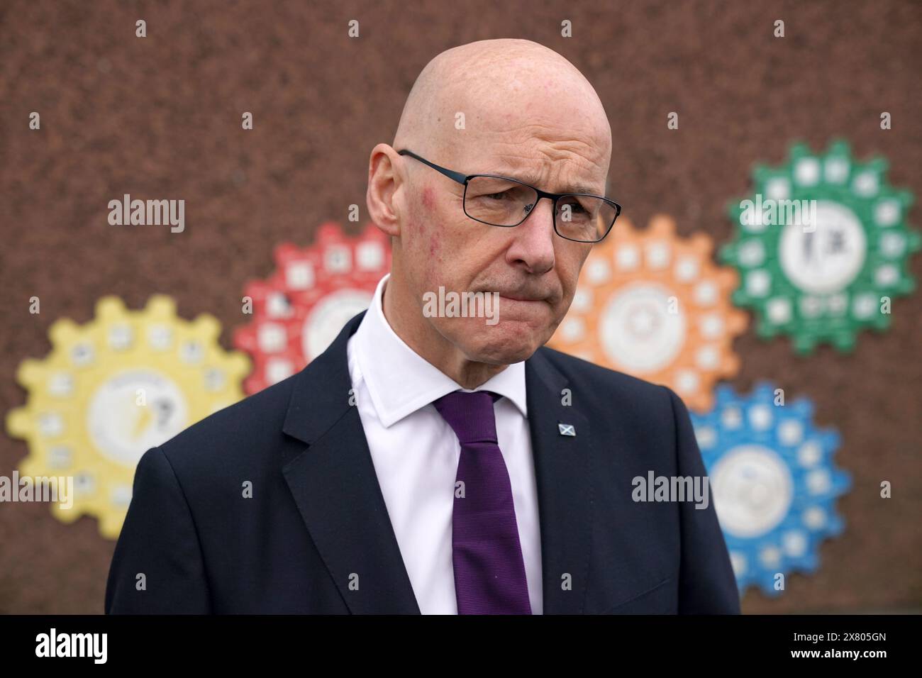 First Minister John Swinney speaks to the media during a visit to a ...