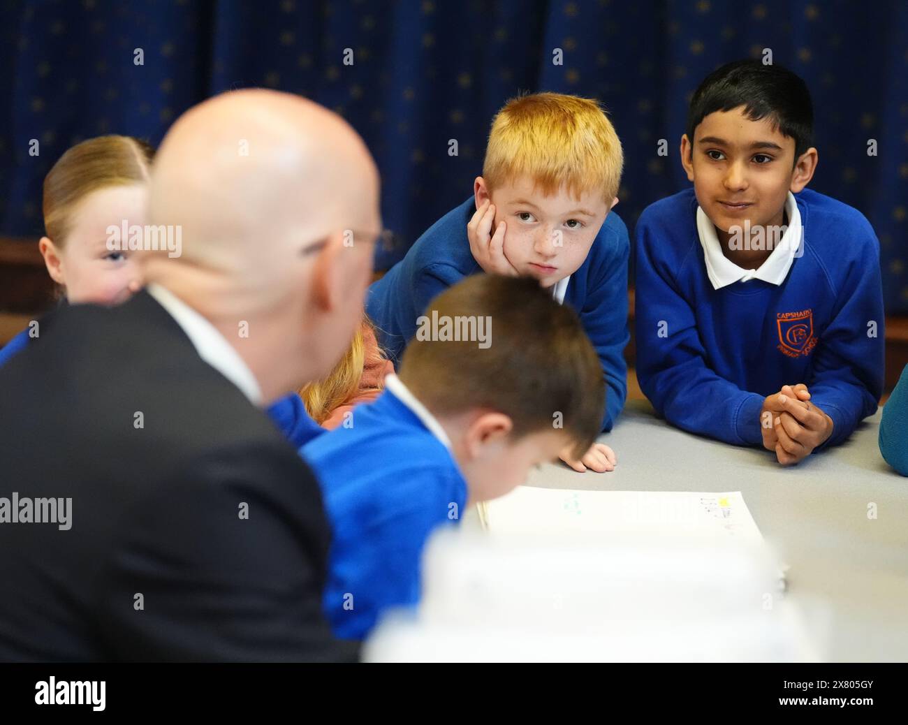 First Minister John Swinney chats to pupils during a visit to a ...