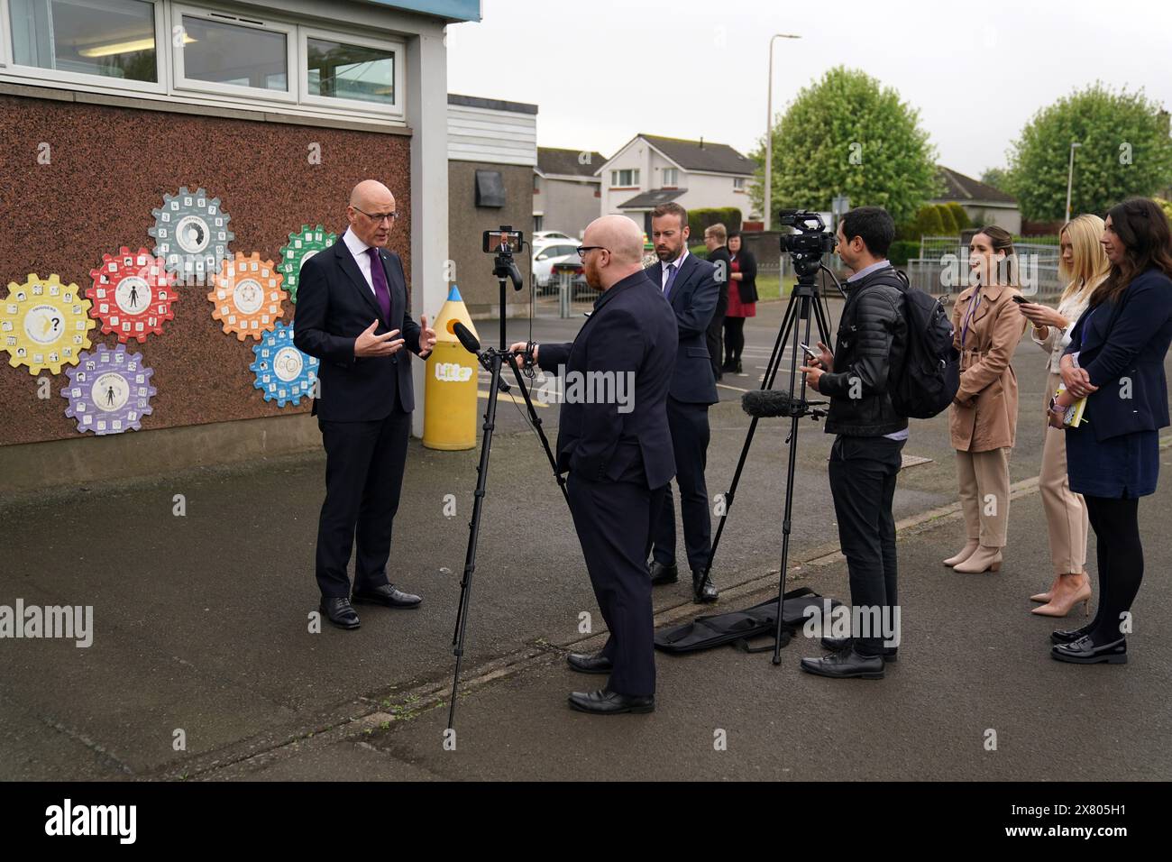 First Minister John Swinney speaks to the media during a visit to a ...