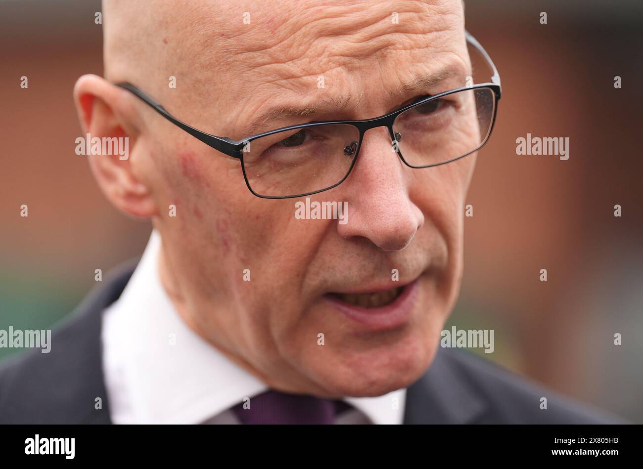 First minister john swinney speaks to the media during a visit to a ...