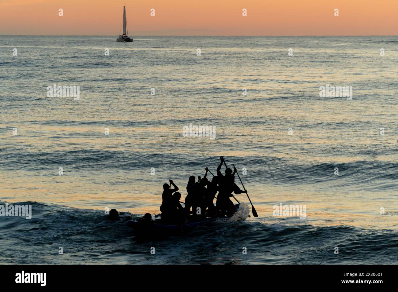 Team of people rowing together a boat to reach a challenge showing ...