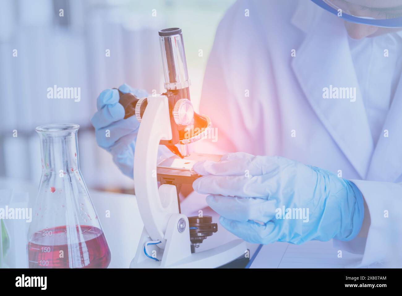 Female scientist look at microscope, science test tube analyse ...