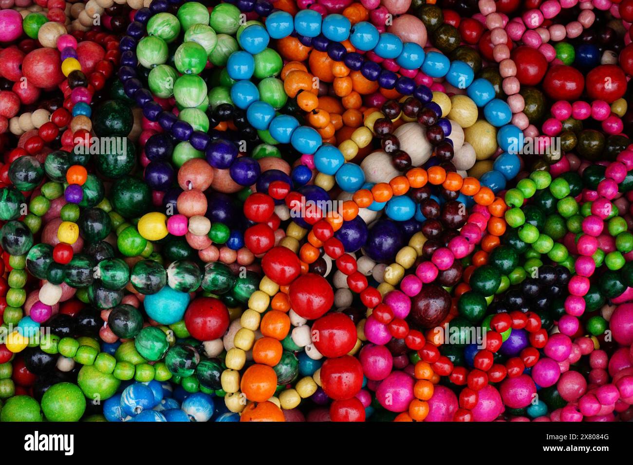 wooden color beads texture as nice background Stock Photo - Alamy