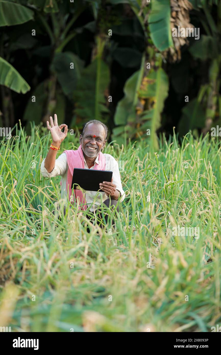 Indian farmer holding tablet Stock Photo - Alamy