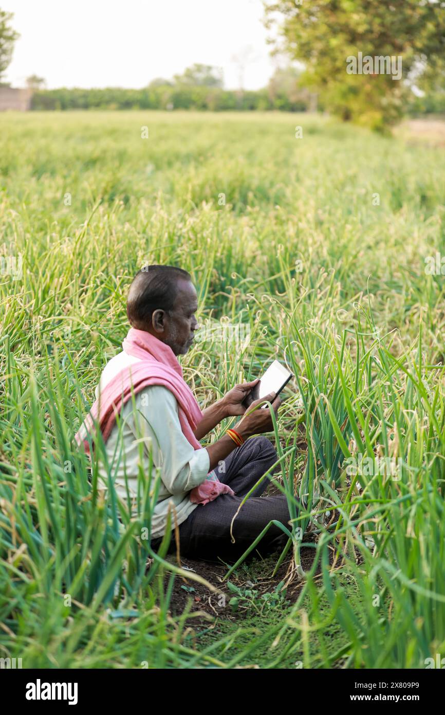 Indian farmer holding tablet Stock Photo - Alamy