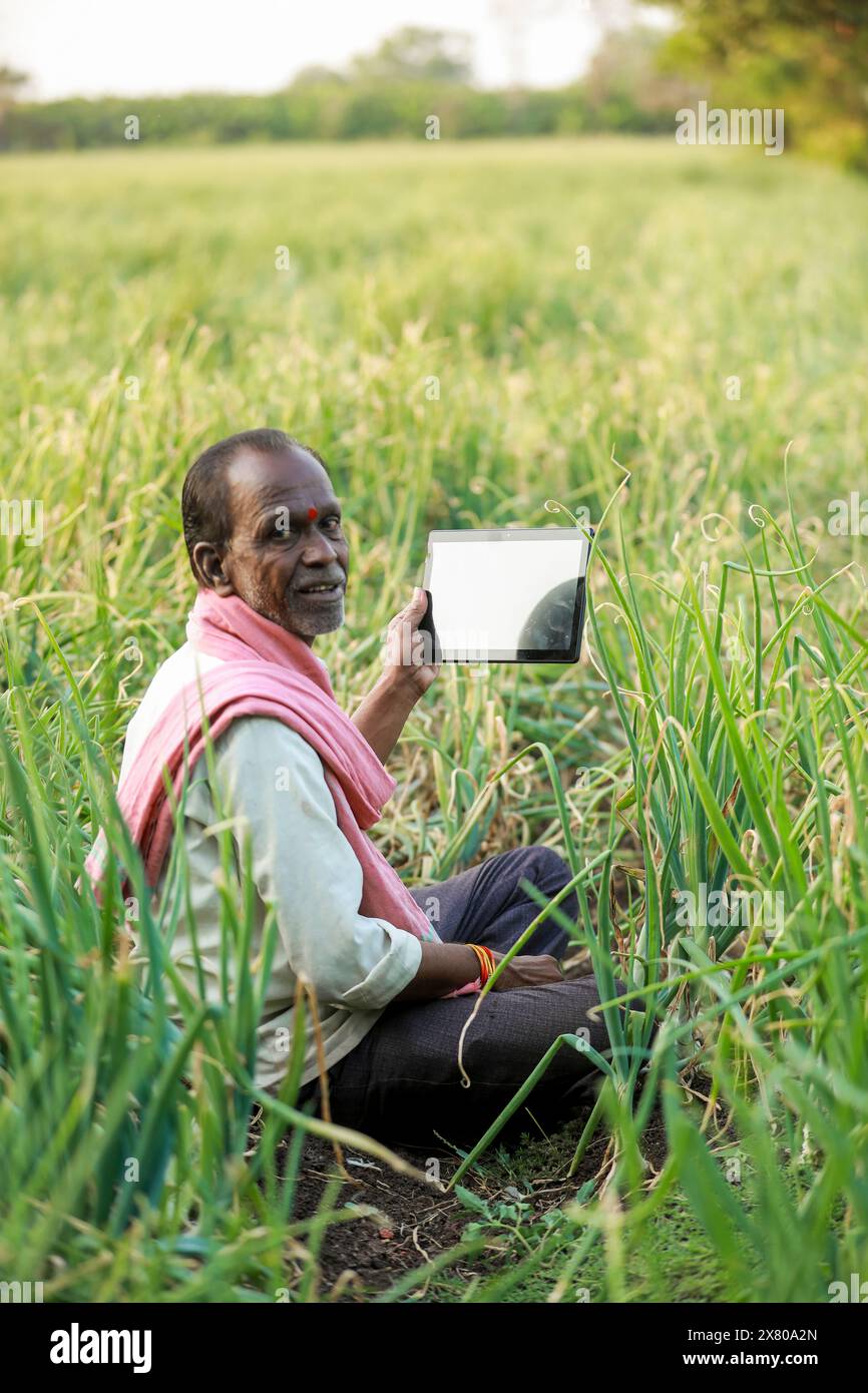 Indian farmer holding tablet Stock Photo - Alamy