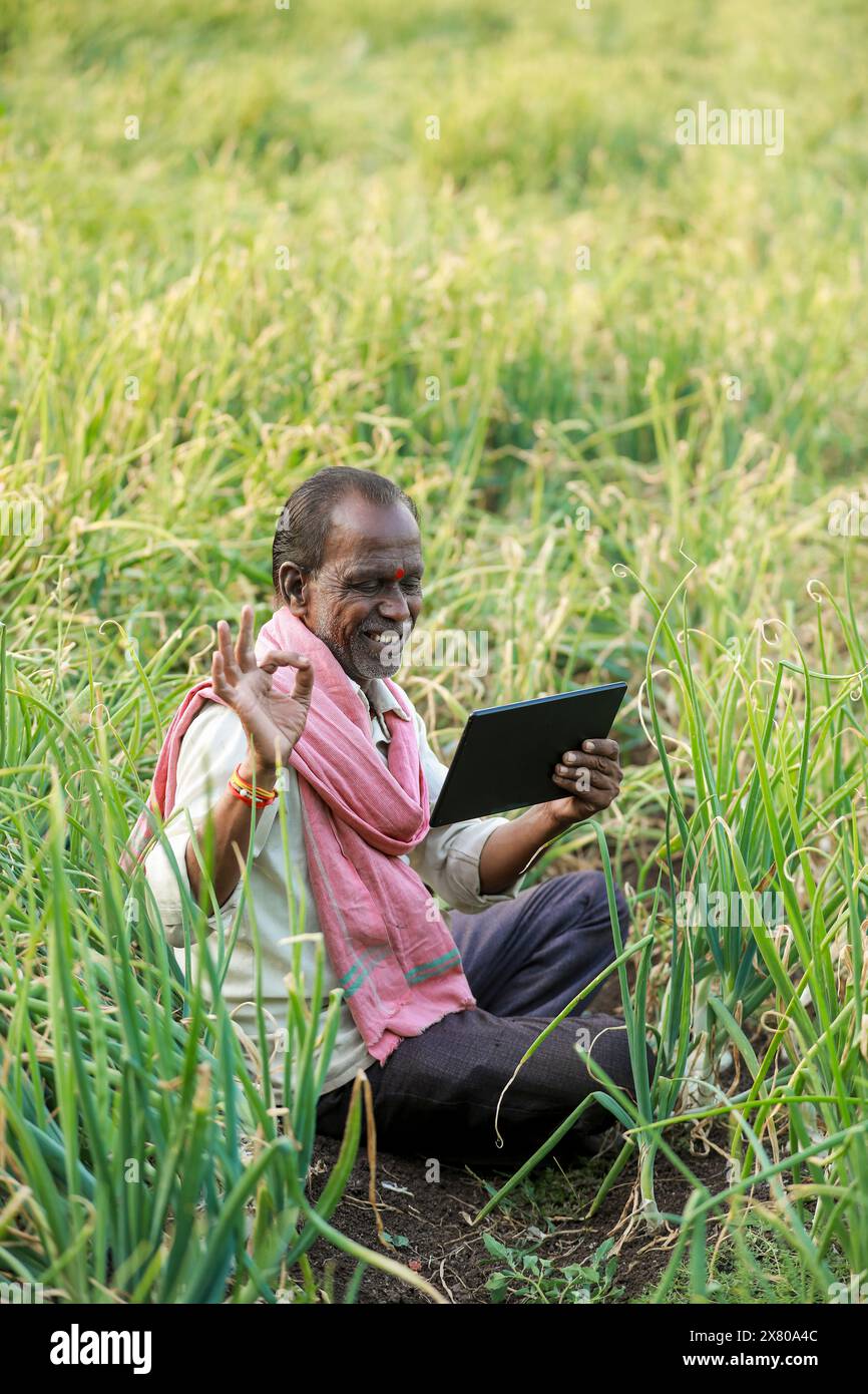 Indian farmer holding tablet Stock Photo - Alamy