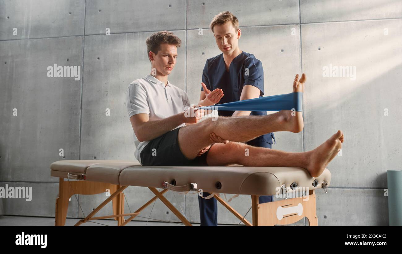 Sport Physiotherapy Specialist Showing How to Stretch a Rubber Band on ...