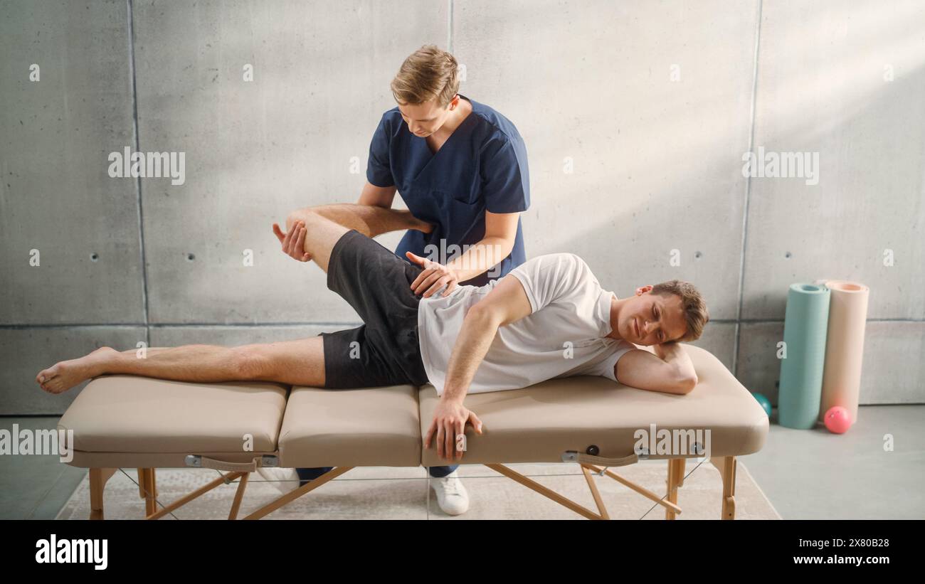 Sportsman Patient Undergoing Physical Therapy to Recover from Surgery ...