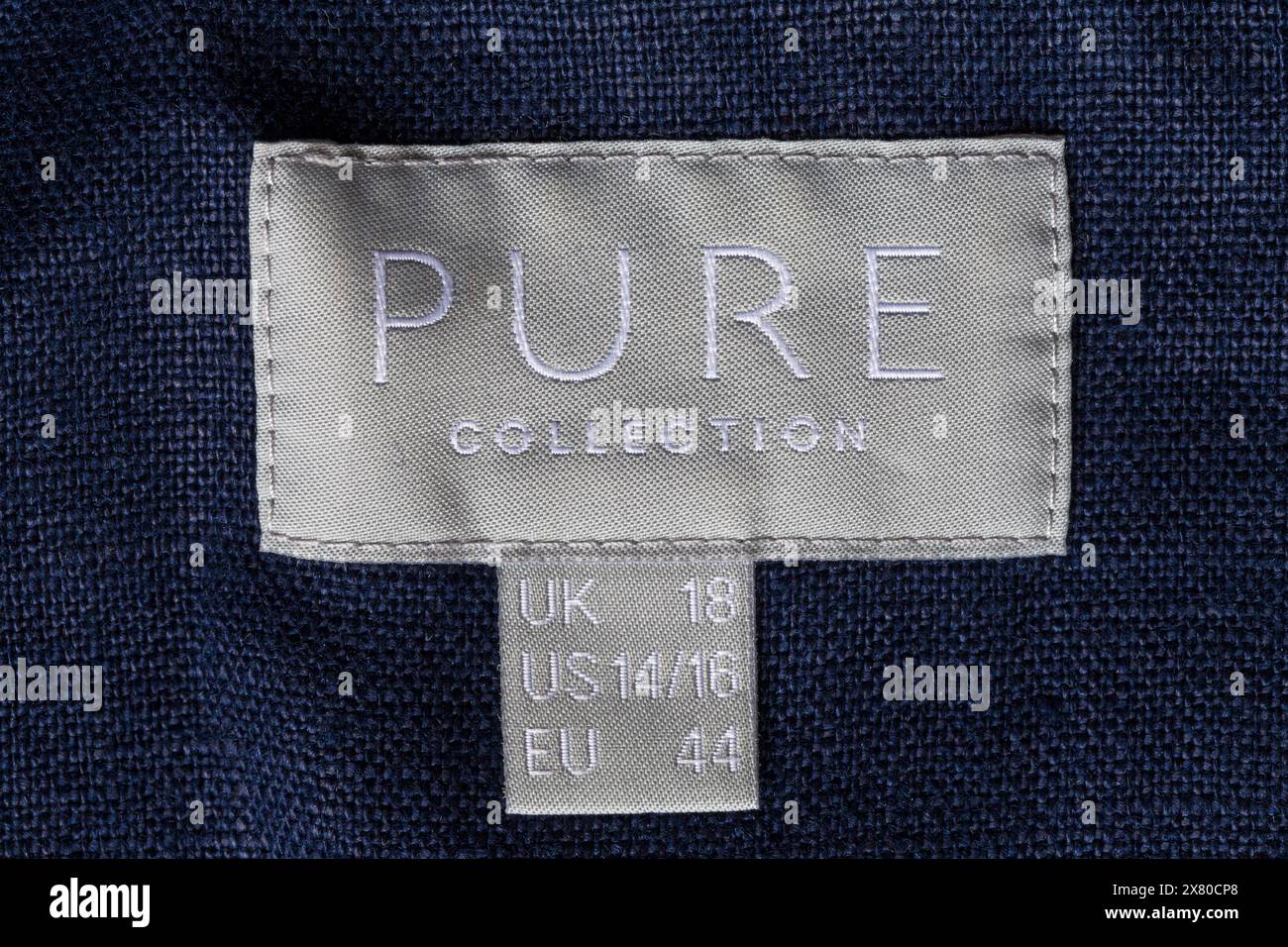 Pure collection label in womans jacket hi-res stock photography and ...