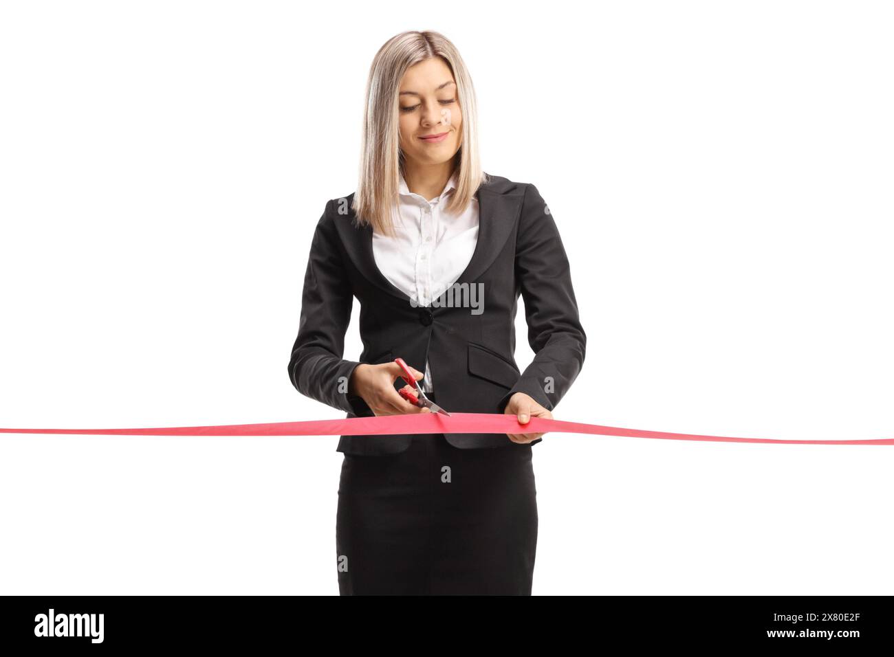 Professional woman cutting a red opening tape isolated on white ...