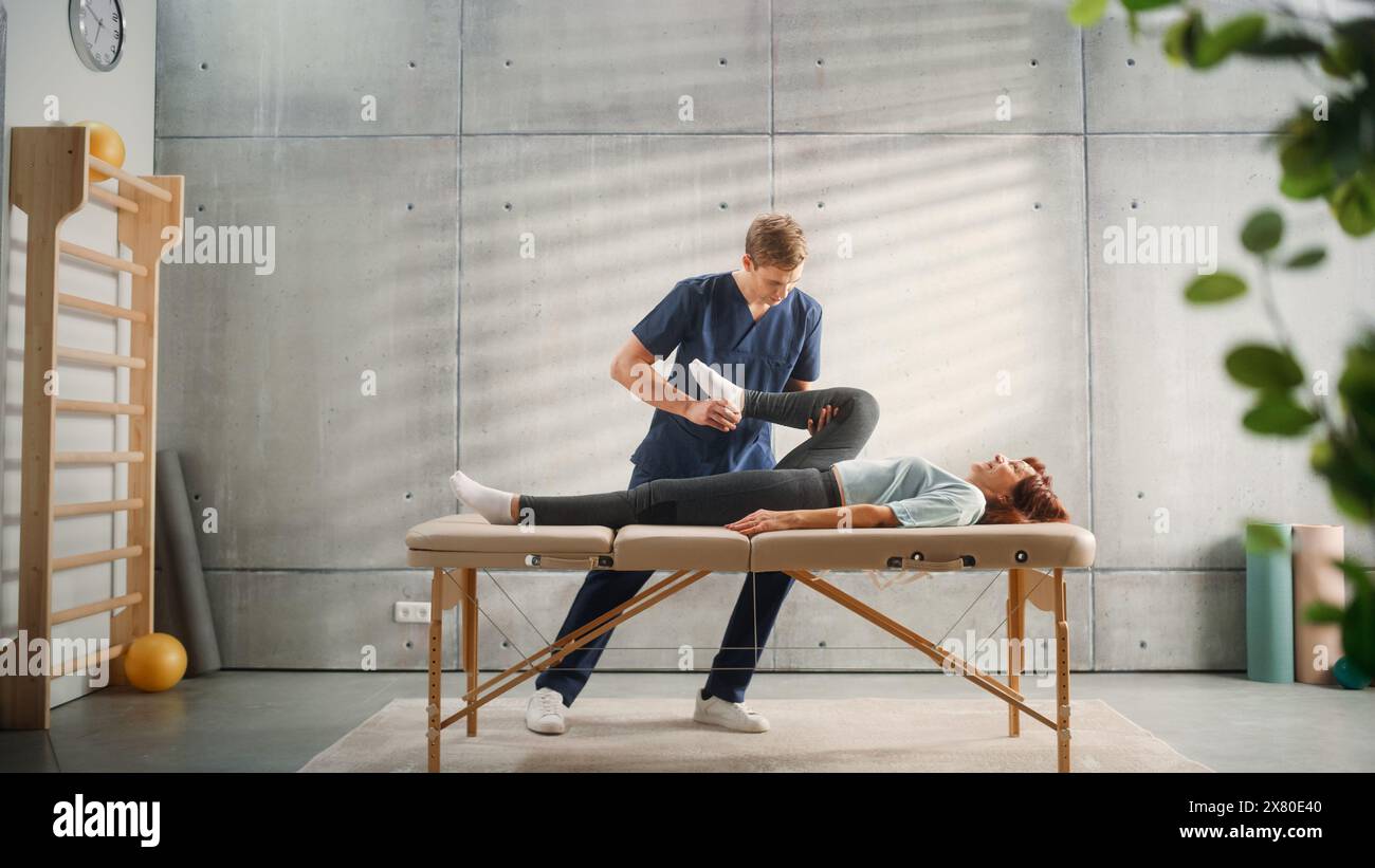 Middle Aged Fit Female Undergoing Physiotherapy, Professional Sport ...