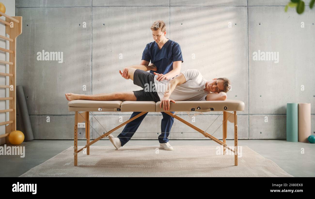Sportsman Patient Undergoing Physical Therapy to Recover from Surgery ...