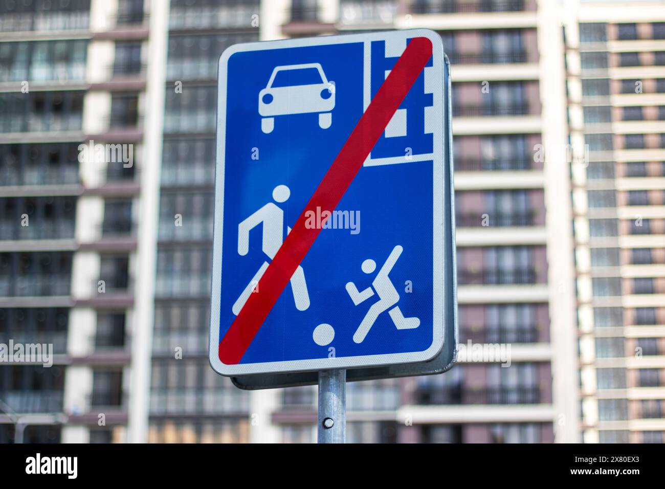 A blue and white sign showing a red line across it, indicating ...
