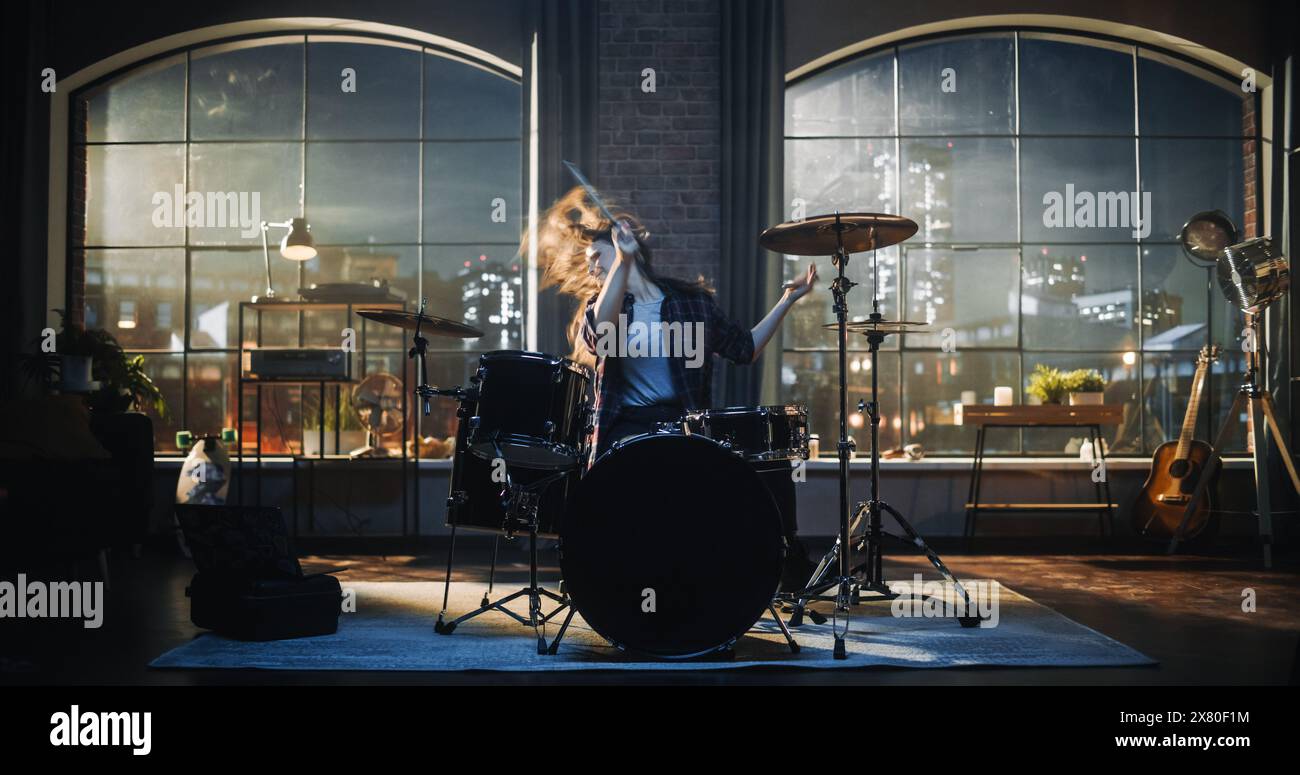 Beautiful Young Drummer Playing at a Band Rehearsal, Doing Tricks with Drumsticks. Learning Drum ...