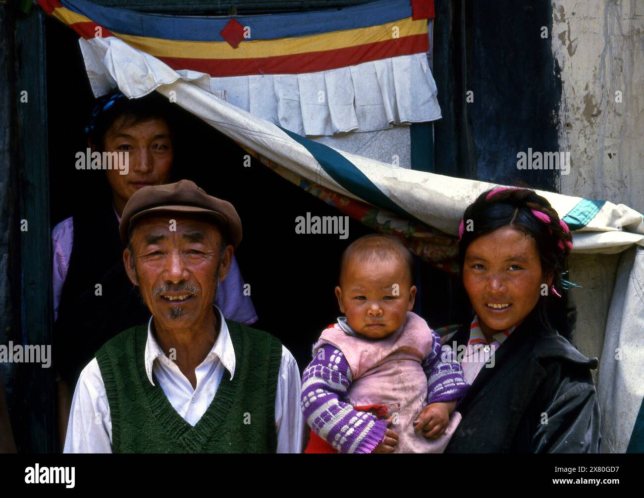 Family outside their home - Lhasa, Tibet Stock Photo - Alamy