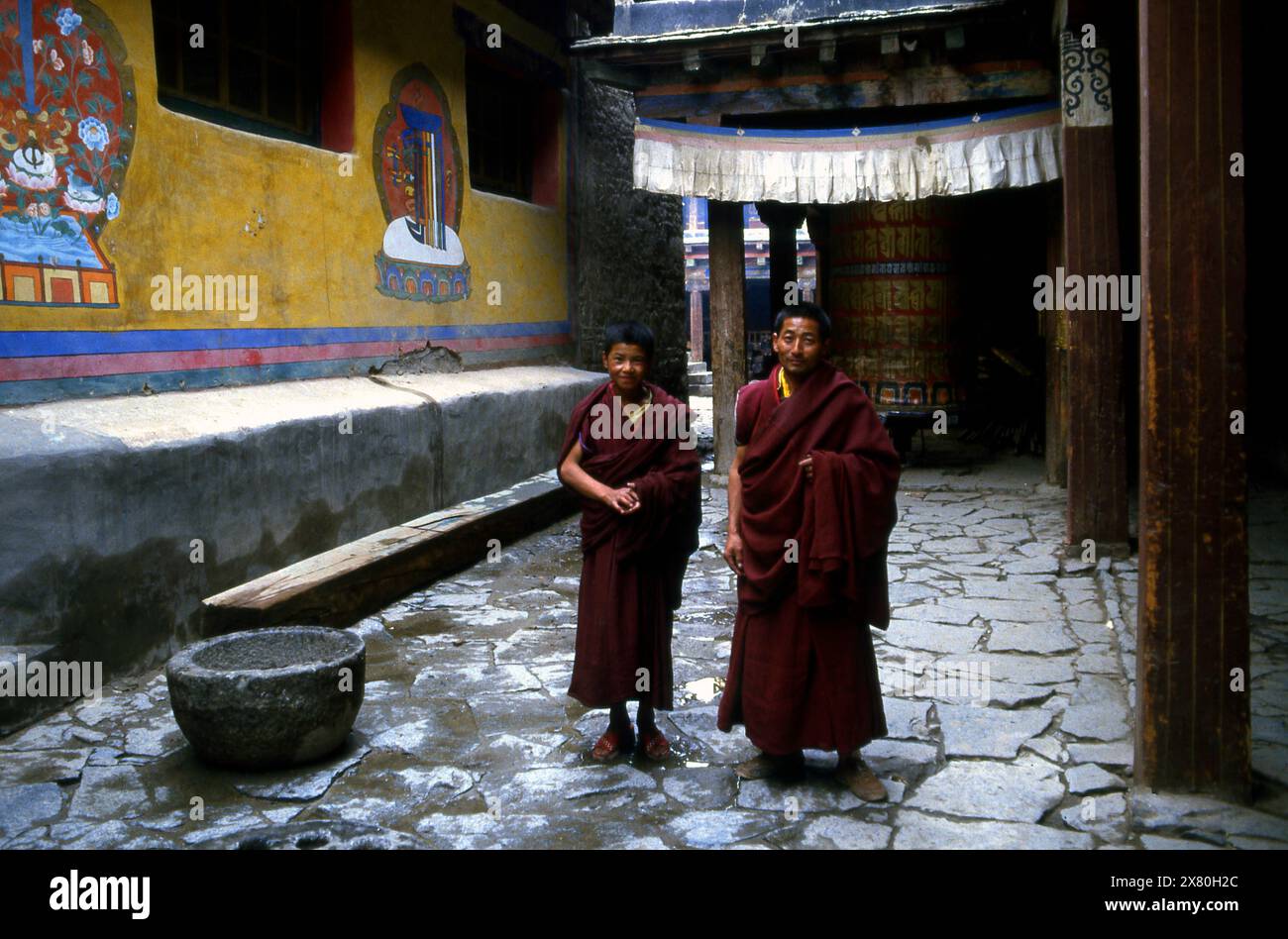 Young monks in monastery courtyard Stock Photo - Alamy